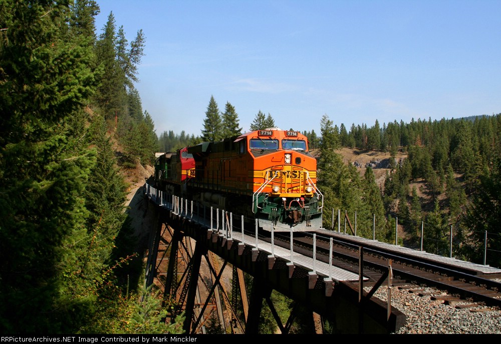 BNSF 7714 leads an eastbound across the Quartz Creek Trestle
